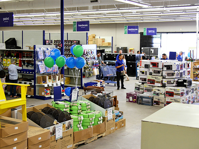 Organized chaos at its finest! Balloons mark special deals while shoppers navigate aisles that promise treasures around every corner.