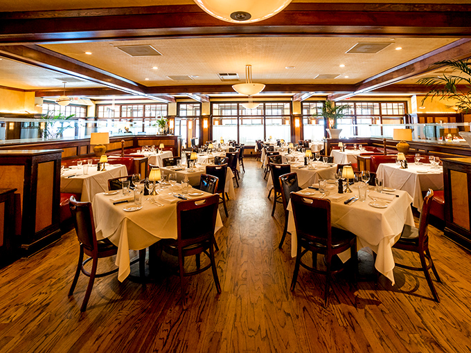 Step inside and you're transported to a bygone era where red walls, crystal chandeliers, and leather booths set the stage for serious steak business.