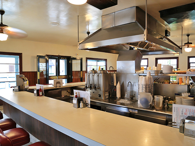 The U-shaped counter isn't just seating—it's theater-in-the-round where burger artisans perform their craft with methodical precision that borders on meditation.
