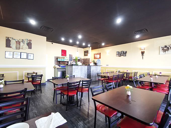 Warm yellow walls and dark wood tables create the kind of cozy setting where food becomes the star of the show.