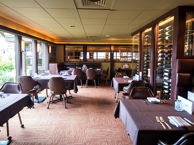 Elegant simplicity defines the dining room where wine racks stand sentinel, ready to pair liquid poetry with your carnivorous masterpiece.