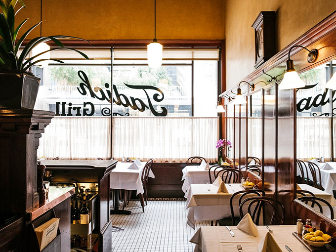 Classic white tablecloths and bentwood chairs create that old-world charm that no amount of modern restaurant design could ever replicate.