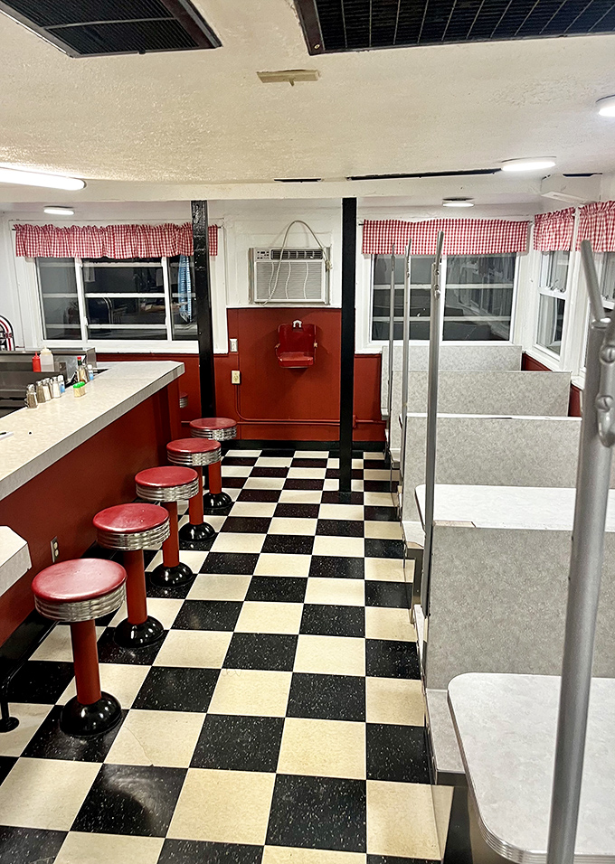 Classic red counter stools and checkerboard floors—the diner equivalent of comfort food for your eyes before the real comfort hits your stomach.