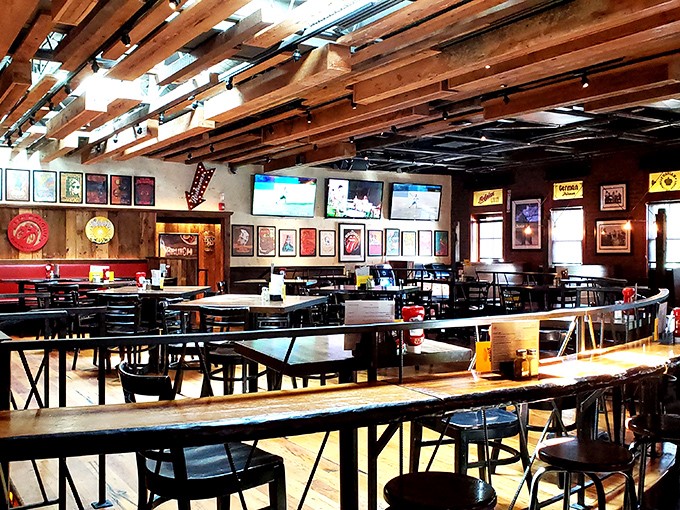 Exposed wooden beams create a rustic cathedral ceiling effect, while the carefully arranged tables invite you to settle in for an evening of exceptional food and drink.