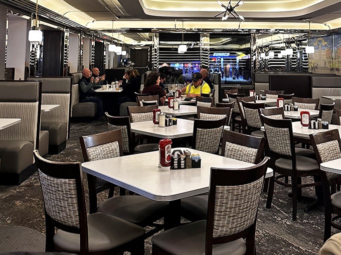 Inside, comfortable booths and retro-modern decor create that perfect diner atmosphere where conversations flow as freely as the coffee.