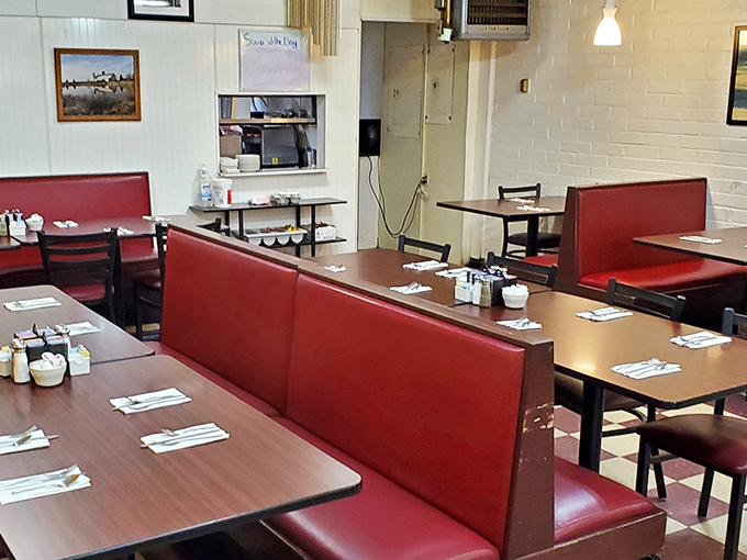 Classic red vinyl booths invite you to slide in and stay awhile – the universal signal that comfort food awaits.