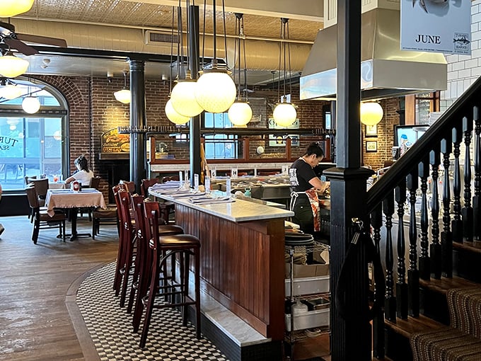 Exposed brick, vintage lighting, and checkered floors create that authentic New England vibe money can't fake or rush.