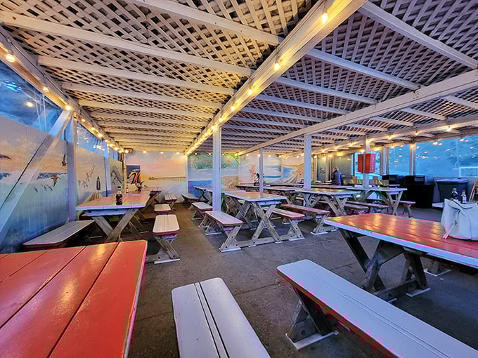 Red-trimmed picnic tables under latticed ceilings create the perfect casual vibe. This isn't fine dining&mdash;it's find dining, where memories are made between bites.