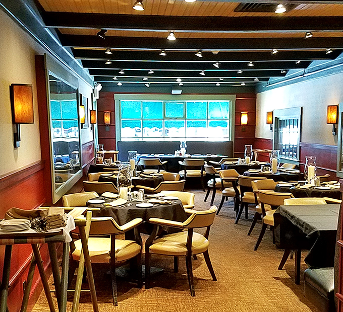 Elegant yet unpretentious dining room where seafood dreams come true. The wood-paneled walls and comfortable seating create the perfect backdrop for the ocean's bounty. 
