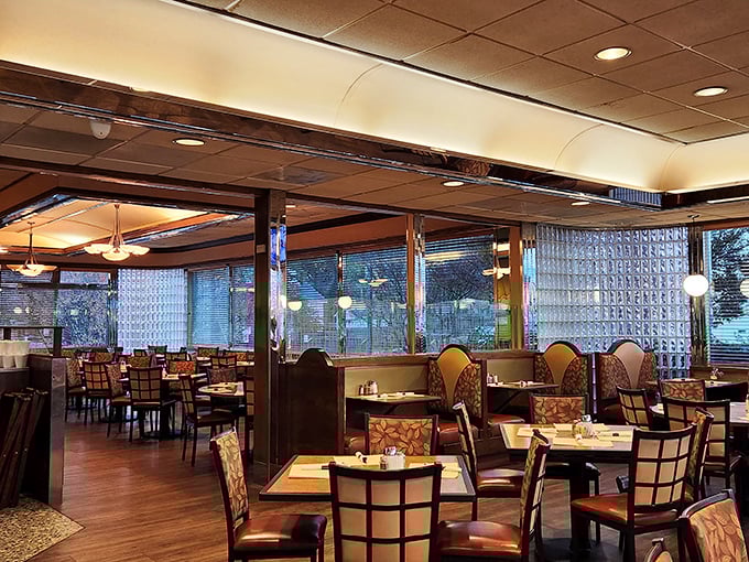 Inside, the warm wood tones and comfortable booths create that perfect diner atmosphere where conversations flow as freely as the coffee.