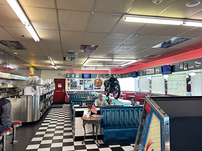 Black and white tiles that would make a chess champion feel at home lead to turquoise booths where comfort food dreams come true. That motorcycle isn't going anywhere&mdash;except maybe into your Instagram feed.