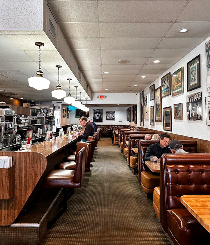 Classic diner perfection: Brown leather booths, pendant lights, and a counter where regulars have been claiming their spots for generations.