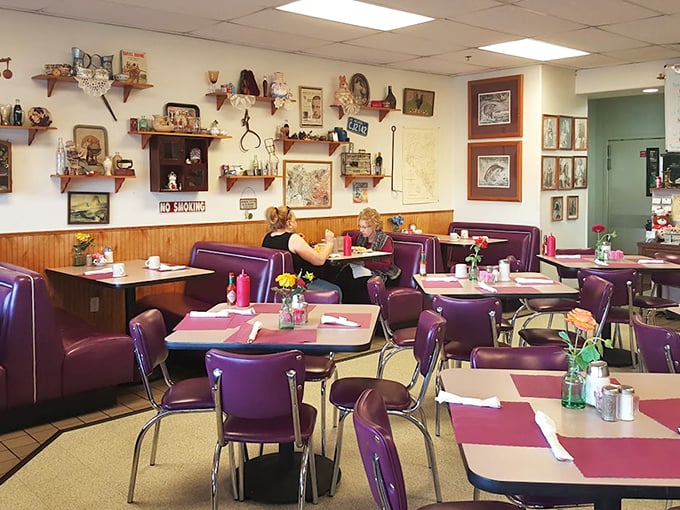 Purple vinyl booths and walls adorned with vintage treasures&mdash;Lou's interior feels like your favorite aunt's kitchen, if she could cook for fifty.