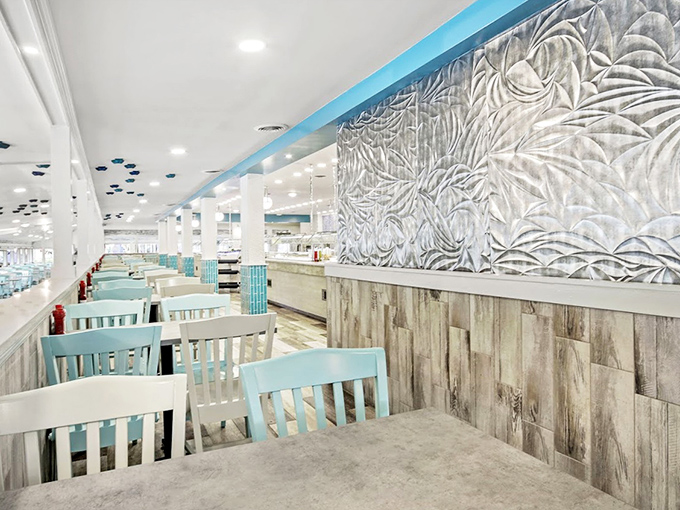 Coastal elegance meets comfort in this airy dining space. The sea-inspired wall art and turquoise chairs create an atmosphere that says, "Stay awhile, the ocean's bounty awaits."