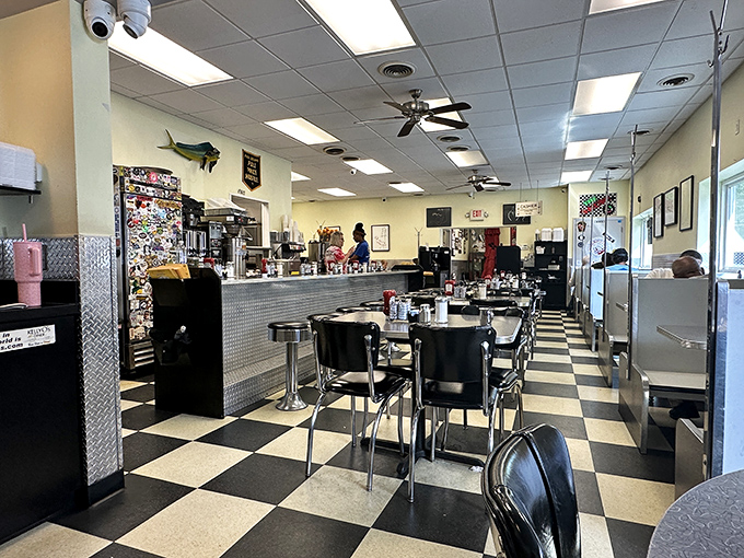 Classic black and white checkered floors meet chrome accents in this quintessential American diner where conversations flow as freely as the coffee.