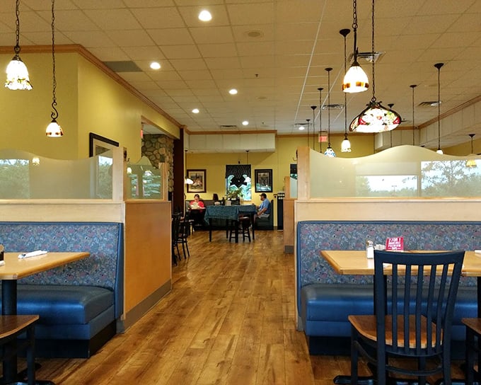 Inside Carol's, Tiffany-style pendant lights cast a warm glow over blue booths and wooden floors&mdash;the perfect backdrop for Minnesota's ultimate comfort food experience.