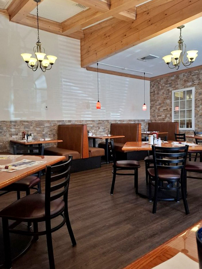 Warm wooden beams, elegant chandeliers, and cozy booths create an atmosphere that's several notches above your typical greasy spoon experience.