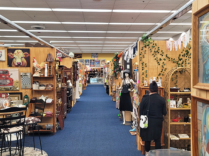 Blue-carpeted aisles stretch like rivers through a landscape of memories, each booth its own little universe of nostalgia and possibility.