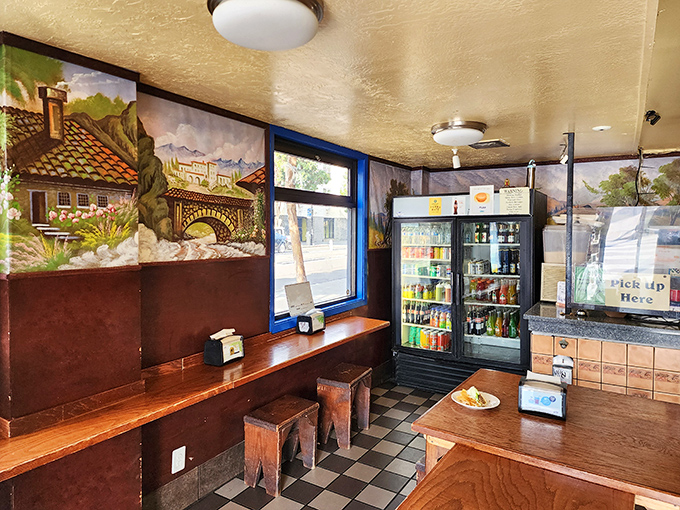 Simple wooden stools and rustic tables set against hand-painted murals create the perfect no-frills backdrop for serious eating.