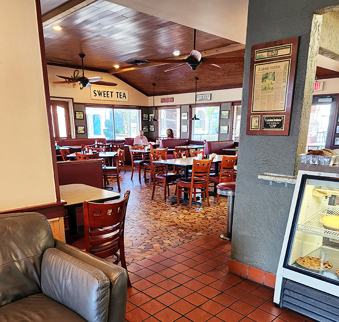 Step inside and you've entered the Southern comfort zone. Wooden ceilings, terra cotta floors, and that "Sweet Tea" sign promising liquid salvation from Florida's heat.