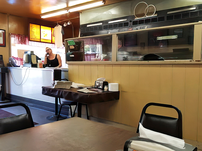 Inside, simplicity reigns supreme. No fancy frills, just a counter where culinary magic has been ordered for generations of Columbus residents.