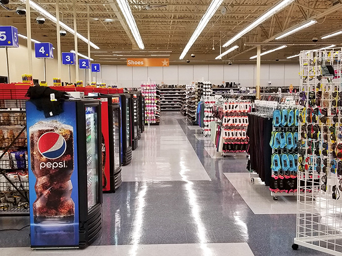 Aisles stretch toward the horizon like highways of possibility, each numbered section a different destination on your thrifting road trip.