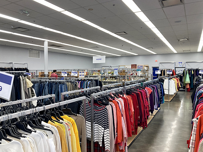 Racks upon racks of color-coded clothing await, organized with surprising precision for a place where chaos could easily reign supreme.