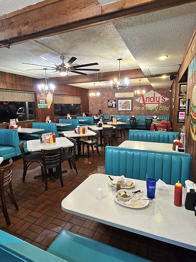 Step inside and the turquoise booths whisper stories of decades past, while wooden paneling creates the warm embrace only classic diners can offer.