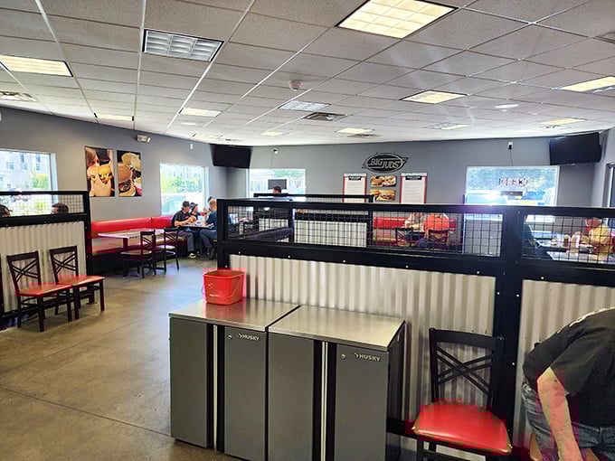 Inside, the no-frills interior with red accents and metal dividers says, "We're not here for the ambiance&mdash;we're here for the burgers."