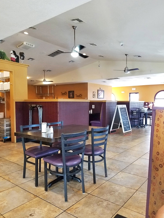 The warm, inviting interior with its golden walls and comfortable seating creates the perfect backdrop for breakfast magic to unfold.