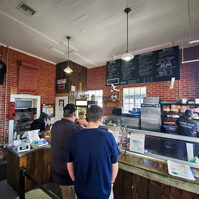 The ordering counter—where dreams come true and diets go to die. That chalkboard menu is basically a roadmap to happiness.
