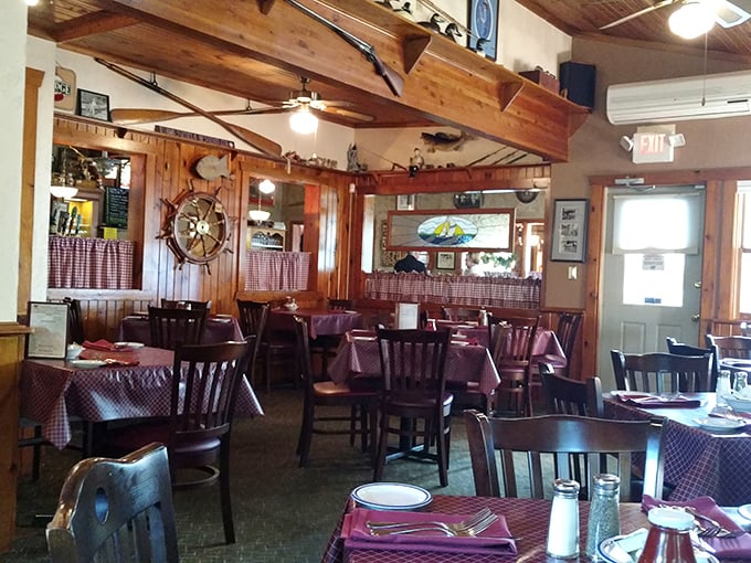 Nautical charm meets supper club coziness inside, where those red checkered tablecloths practically whisper, "Sit down, stay awhile, order seconds."