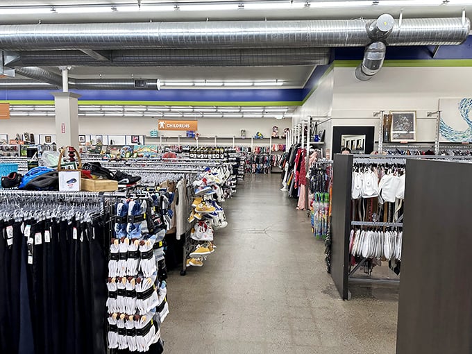 Racks upon racks of meticulously organized clothing stretch toward the horizon. The thrill of the hunt begins in these orderly aisles of possibility.