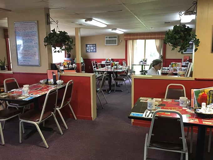 Red wainscoting meets yellow walls in this diner where comfort isn't just on the menu &ndash; it's built into every surface, hanging plant, and welcoming booth.
