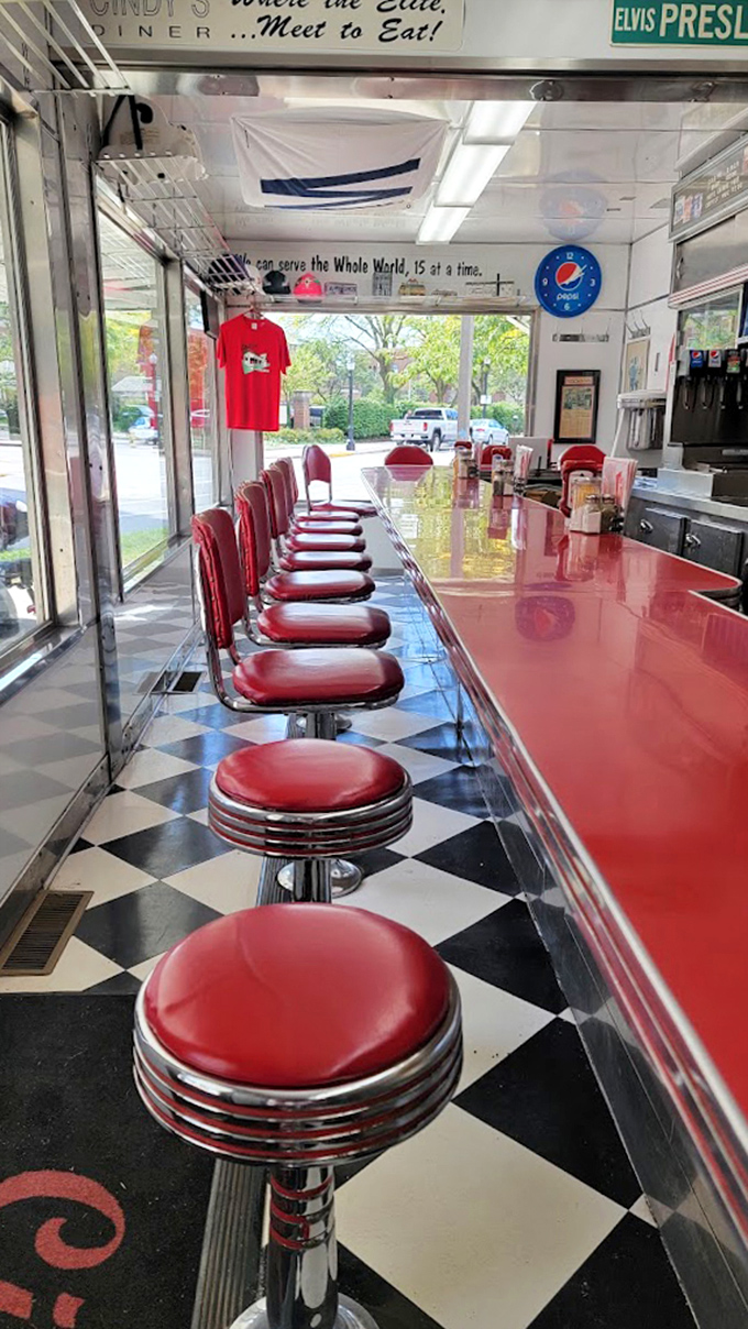 Fifteen cherry-red stools line the gleaming counter&mdash;each one a front-row seat to breakfast theater where regulars become family and newcomers become regulars.