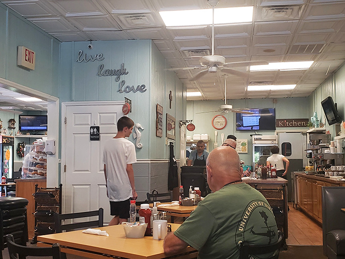 The "Live, Laugh, Love" sign feels right at home here, where regulars do exactly that over plates of perfectly cooked breakfast classics.