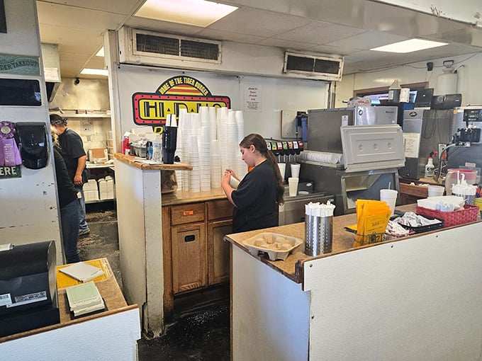 Behind the counter, where burger magic happens. No molecular gastronomy here&mdash;just decades of know-how and grill mastery.
