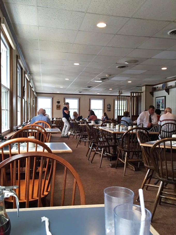Windsor chairs and simple tables create the perfect backdrop for breakfast magic. No designer flourishes needed when the food does all the talking.