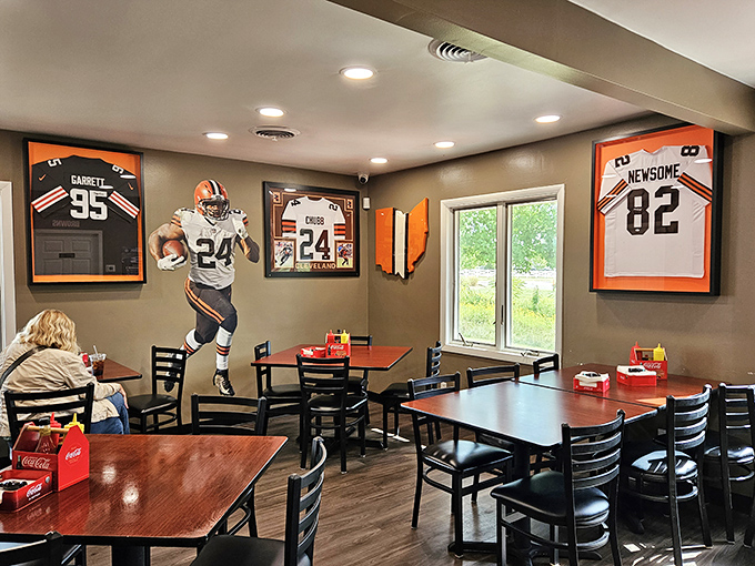 Cleveland sports memorabilia transforms this dining room into a temple of local pride, where Browns jerseys watch over your meal like friendly guardians.