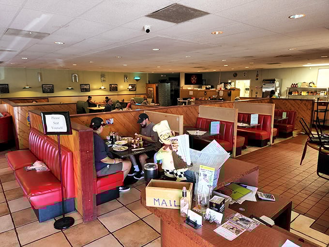Classic red vinyl booths and wooden dividers&mdash;the universal language of "sit down, relax, and prepare for comfort food that hugs your soul."