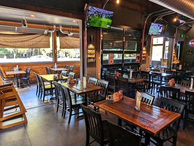 Modern meets cozy in this thoughtfully designed dining space where wooden tables invite you to linger long after your last slice disappears.