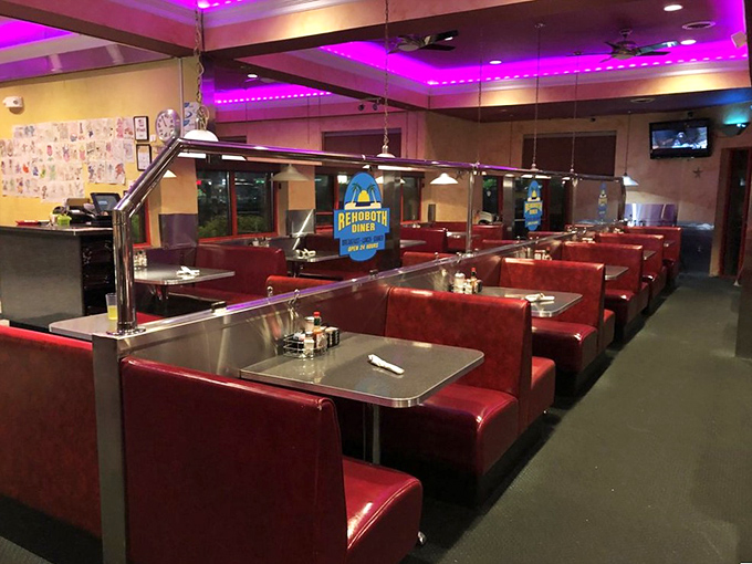 Red vinyl booths bathed in purple lighting create that perfect "I'm about to eat something wonderful" atmosphere. Comfort begins before the menu arrives.