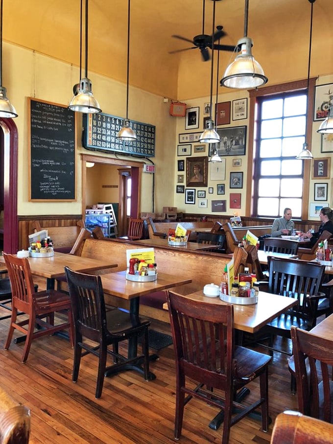 Church pews repurposed for dining? Genius! The warm wooden interior creates an atmosphere where comfort food and comfort feel perfectly at home.