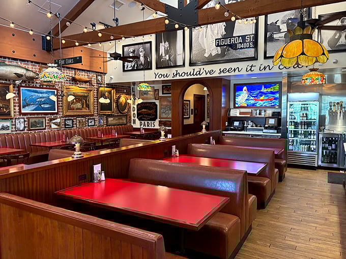 Red booths, wooden beams, and walls packed with maritime memorabilia—dining here feels like being inside the world's coziest ship captain's quarters.