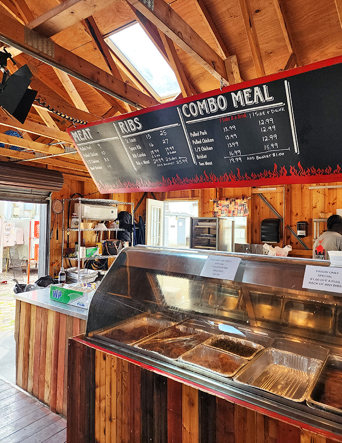 Wooden beams frame the no-nonsense menu board&mdash;a roadmap to happiness where every choice leads to smoky satisfaction.