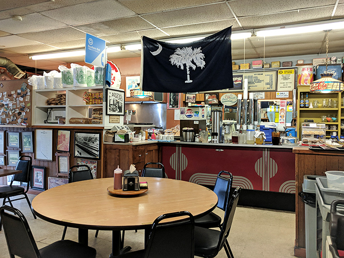Inside, the South Carolina flag watches over a counter that's witnessed more local gossip than a church picnic. This isn't retro by design&mdash;it's authentic by survival.