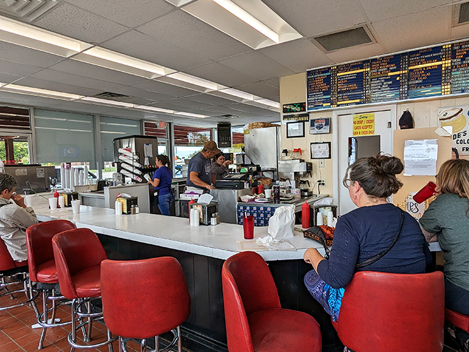 Where burger magic happens. The red counter stools have witnessed decades of first bites and satisfied sighs from locals and travelers alike.
