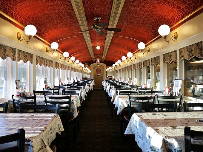 Step inside and you're transported to a bygone era of elegant rail travel, where the curved ceiling and vintage fixtures make dinner feel like a journey.