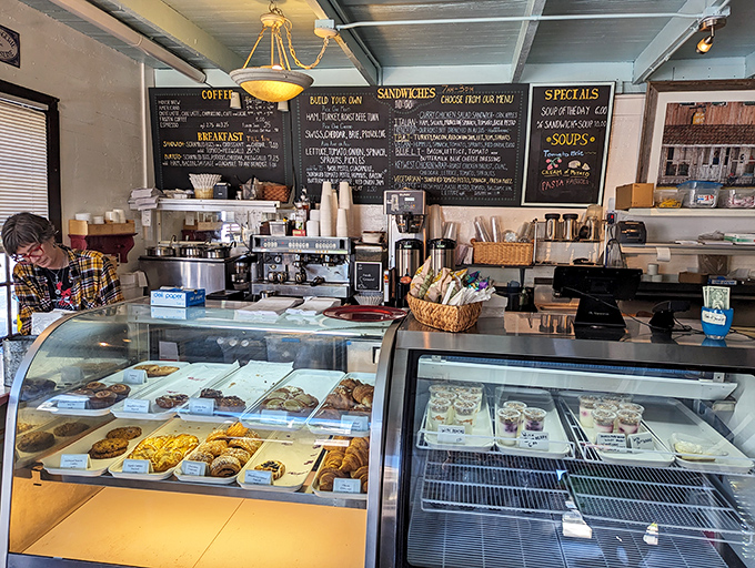 Sunshine streaming through the windows illuminates display cases that contain what happiness would look like if it took solid form.