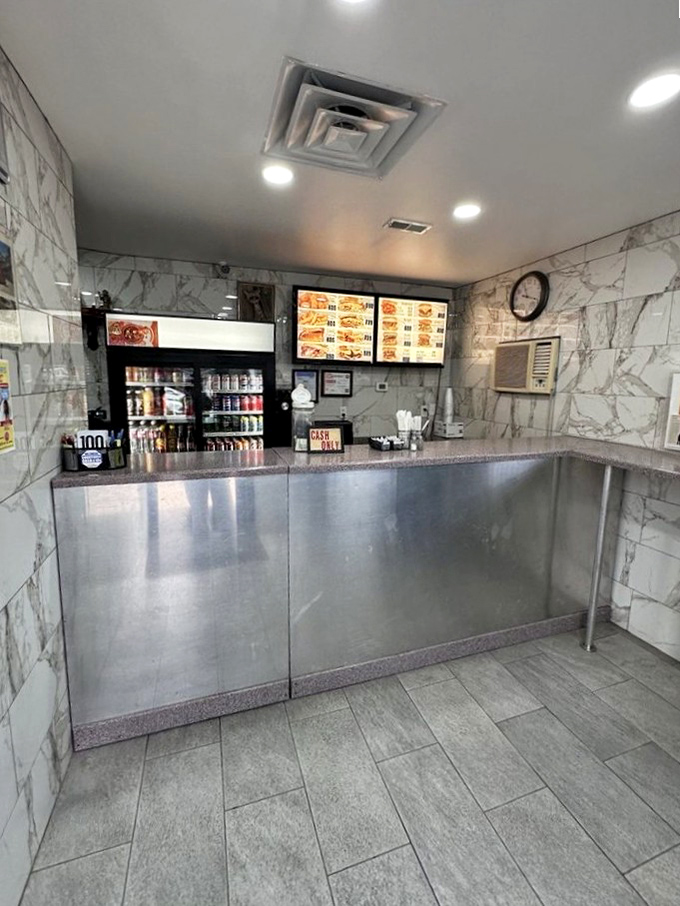 Marble walls and stainless steel simplicity &ndash; this ordering counter has witnessed decades of sandwich anticipation and satisfied smiles.